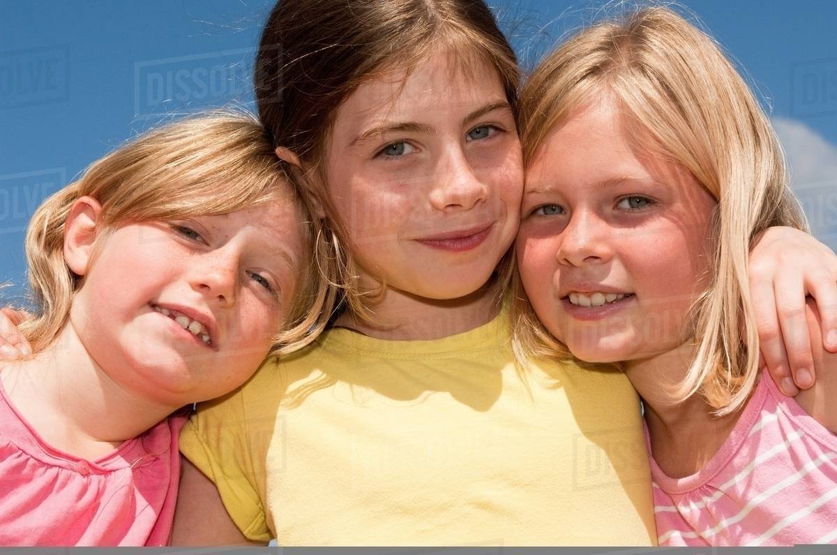 Three girls, portrait - Royalty-free Stock Photo | Dissolve