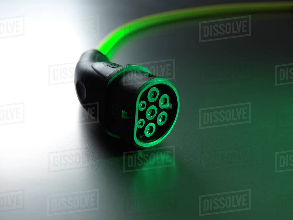 Studio shot of green electric car charging cable - Royalty-free Stock ...