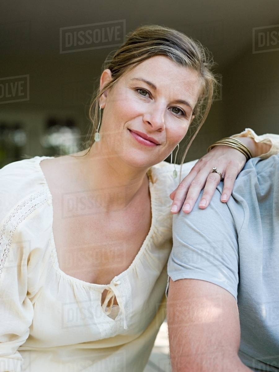Woman with hand on man's shoulder, portrait - Royalty-free Stock Photo ...