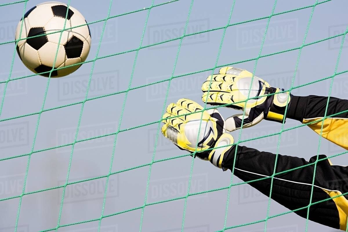 Goalkeeper making a save - Royalty-free Stock Photo | Dissolve