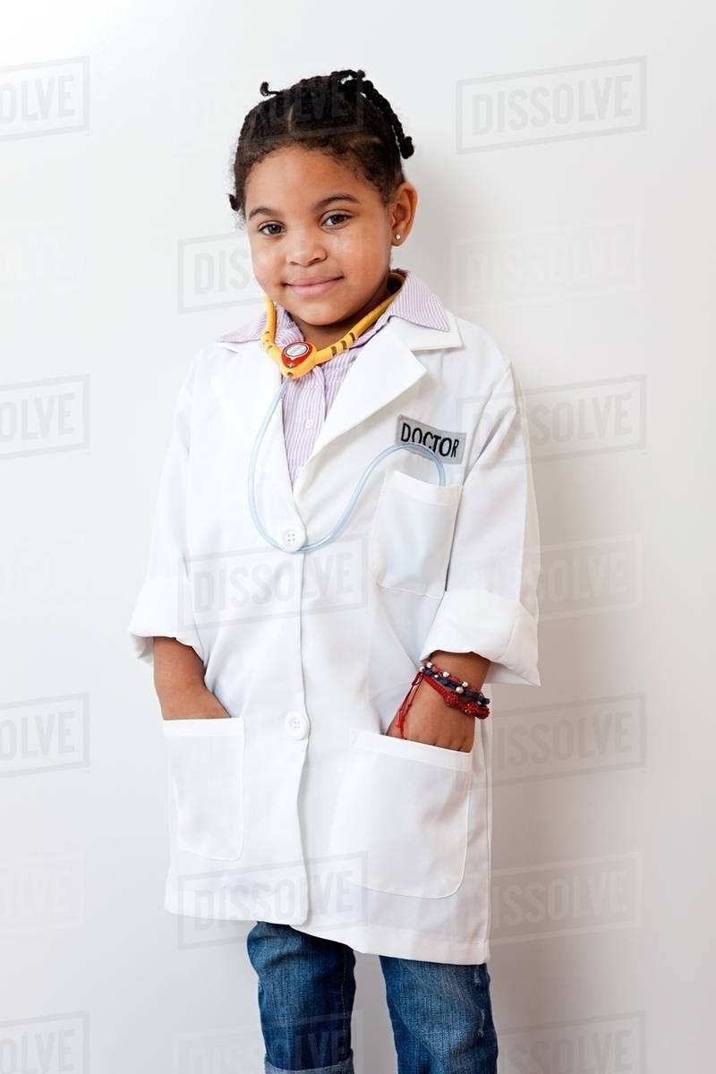 Girl dressing up as doctor - Royalty-free Stock Photo | Dissolve