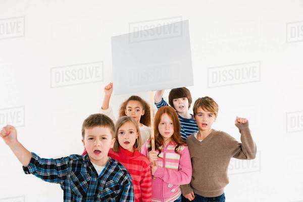 Children protesting with placard - Royalty-free Stock Photo | Dissolve