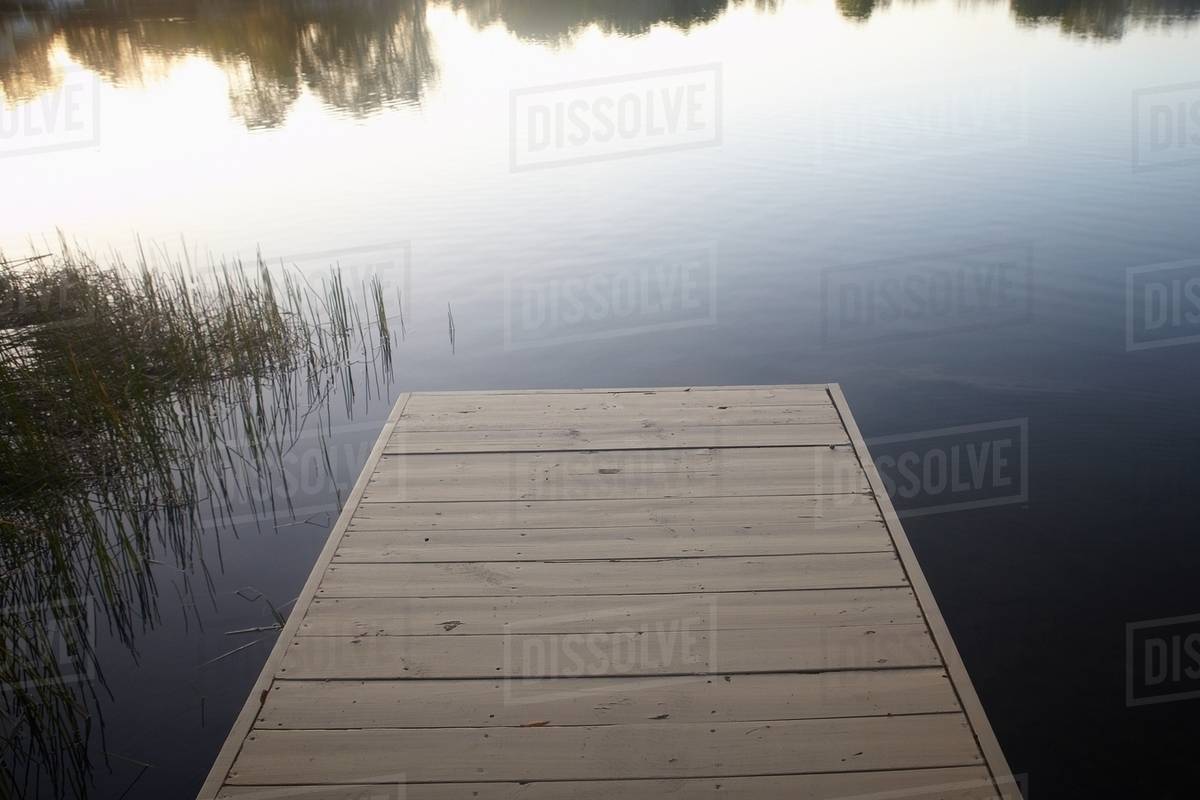 Wooden jetty and lake - Stock Photo - Dissolve