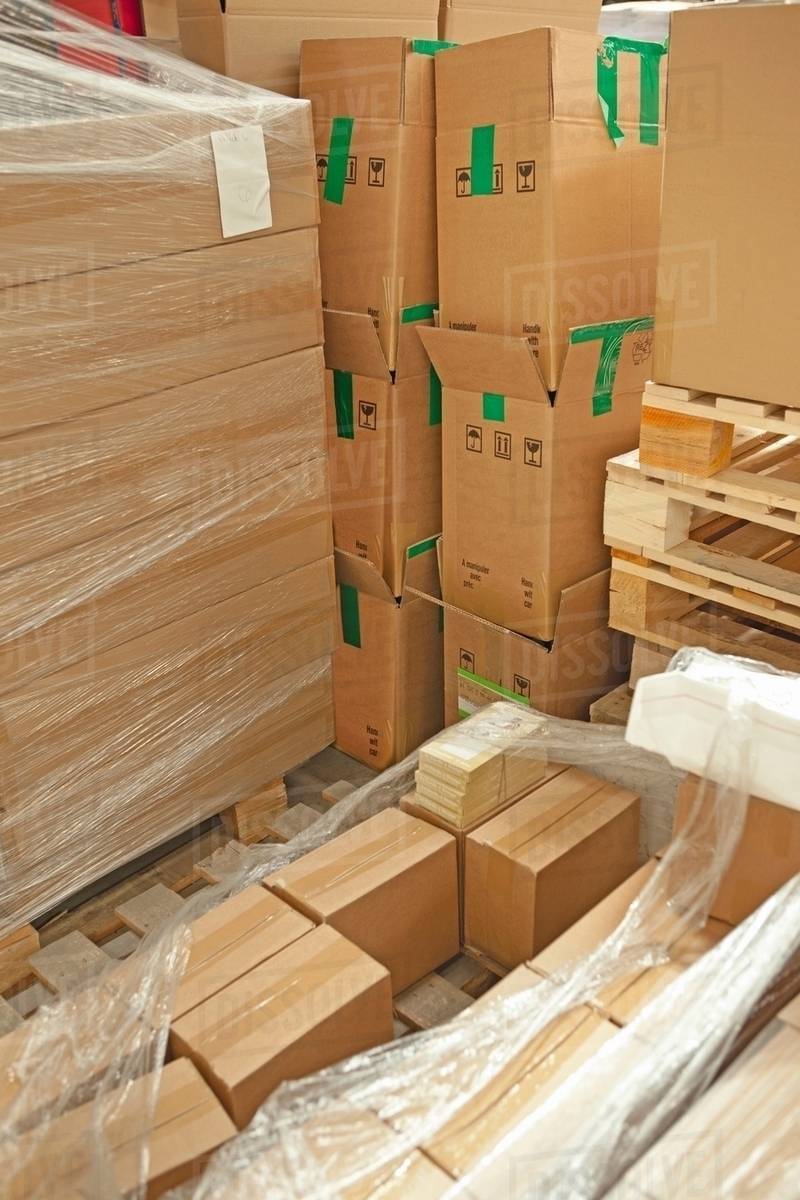 Cardboard boxes in warehouse - Royalty-free Stock Photo | Dissolve