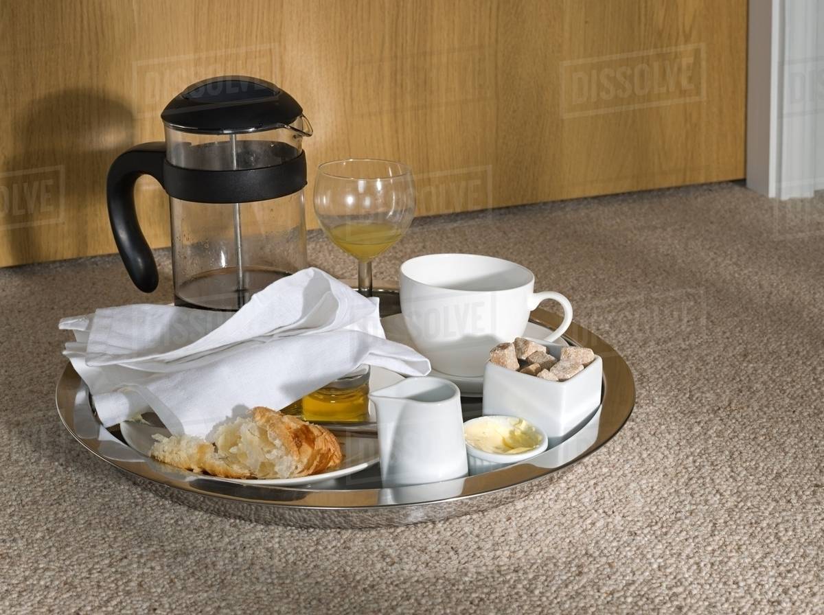 Food tray outside a hotel room - Royalty-free Stock Photo | Dissolve