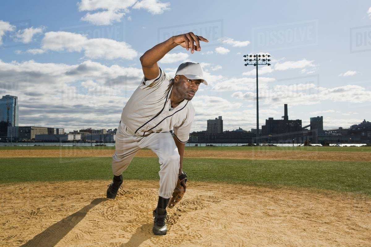 Baseball pitcher throwing a ball - Royalty-free Stock Photo | Dissolve