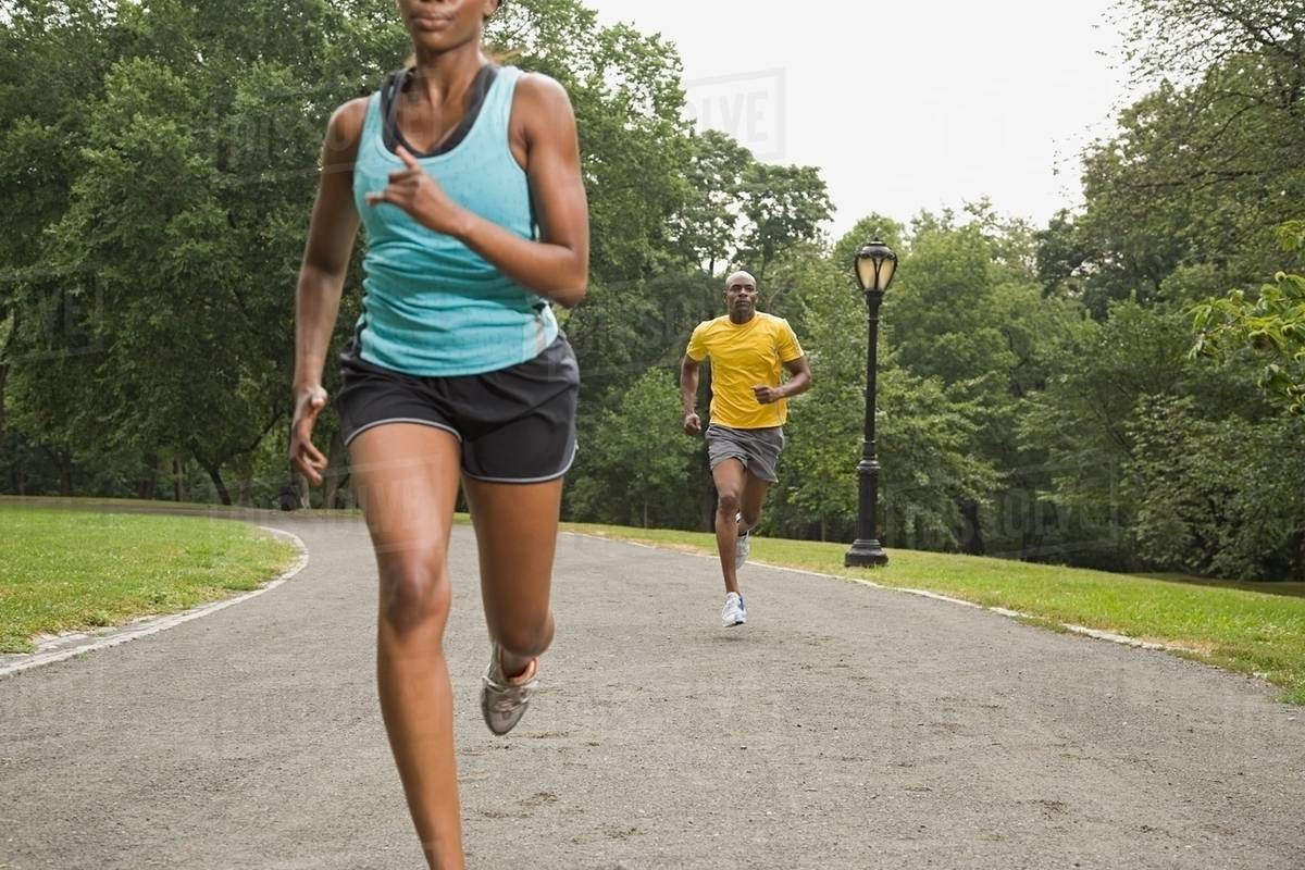 Runners in park - Royalty-free Stock Photo | Dissolve