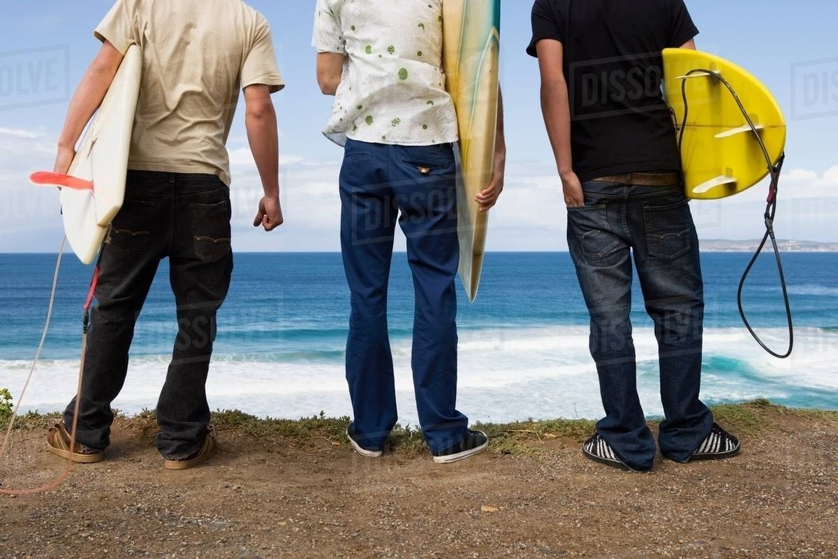 Three surfers - Stock Photo - Dissolve