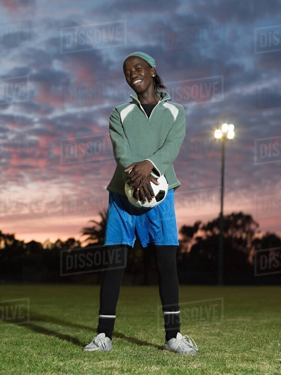Teenage african boy with football - Royalty-free Stock Photo | Dissolve