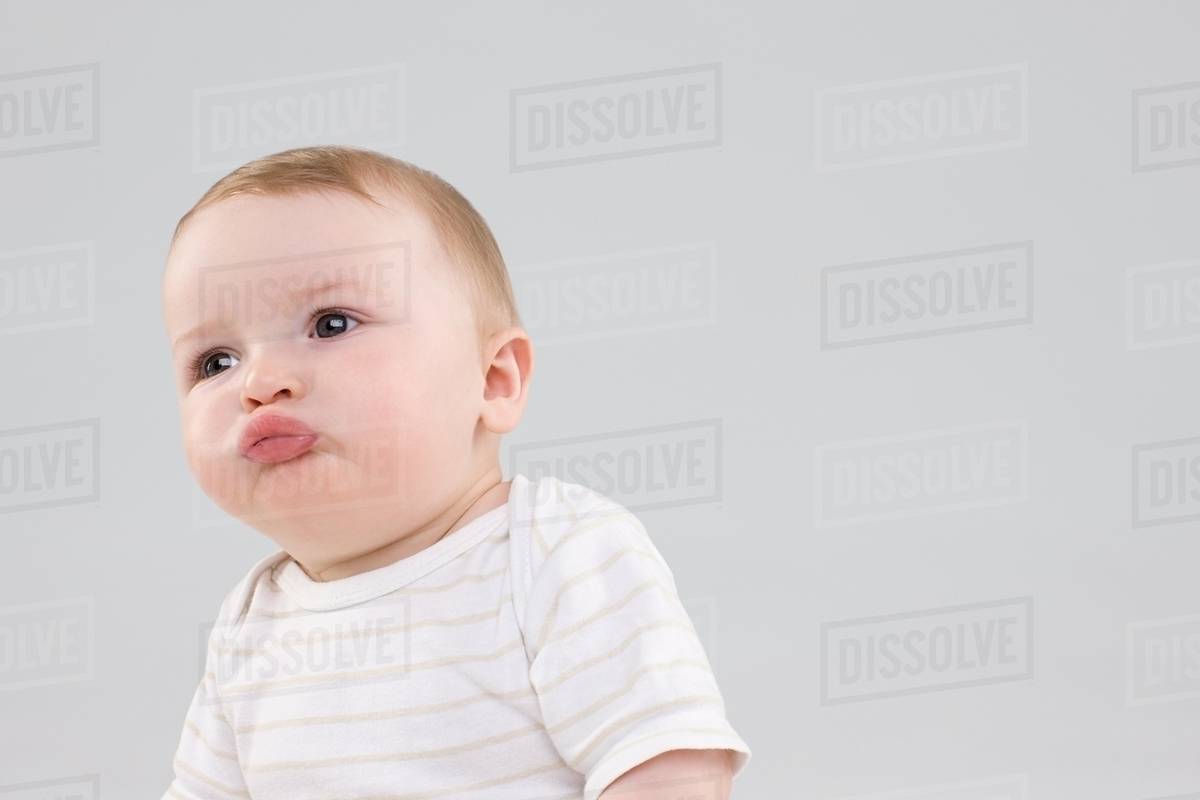 Baby making faces - Royalty-free Stock Photo | Dissolve