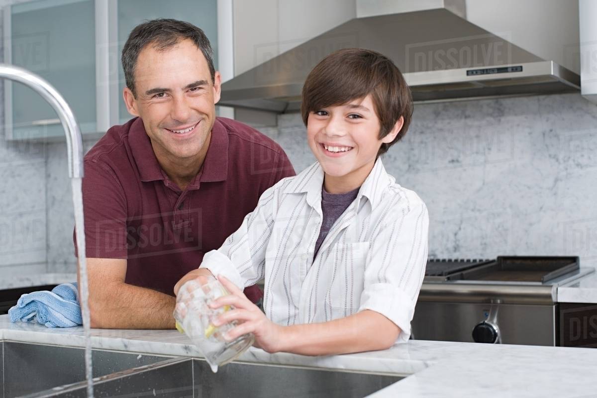 Father and son washing up - Royalty-free Stock Photo | Dissolve