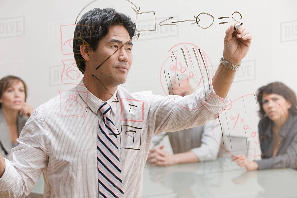 Man drawing diagram on glass - Royalty-free Stock Photo | Dissolve