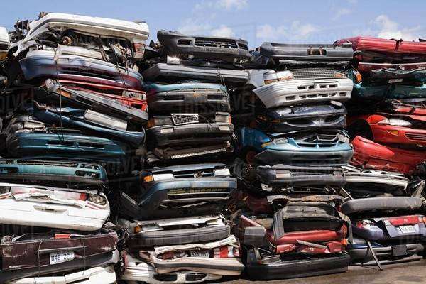 Stacks of crushed cars - Stock Photo - Dissolve