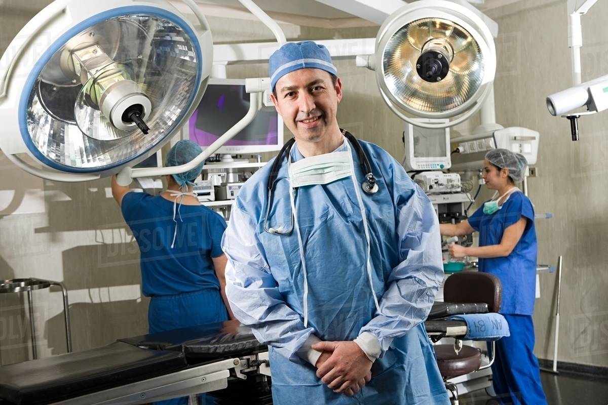 Surgeons in operating room - Stock Photo - Dissolve