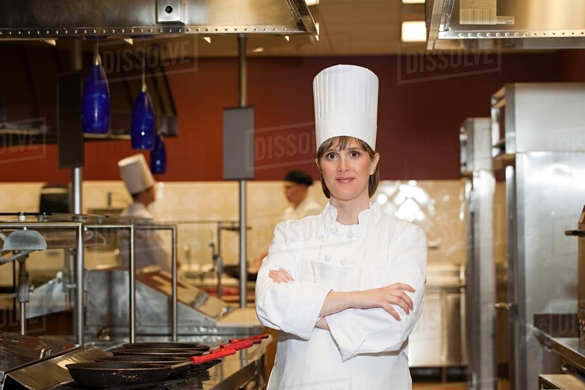 Chefs in commercial kitchen, portrait - Royalty-free Stock Photo | Dissolve