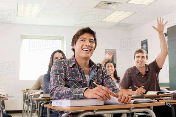High school students sitting in classroom - Stock Photo - Dissolve