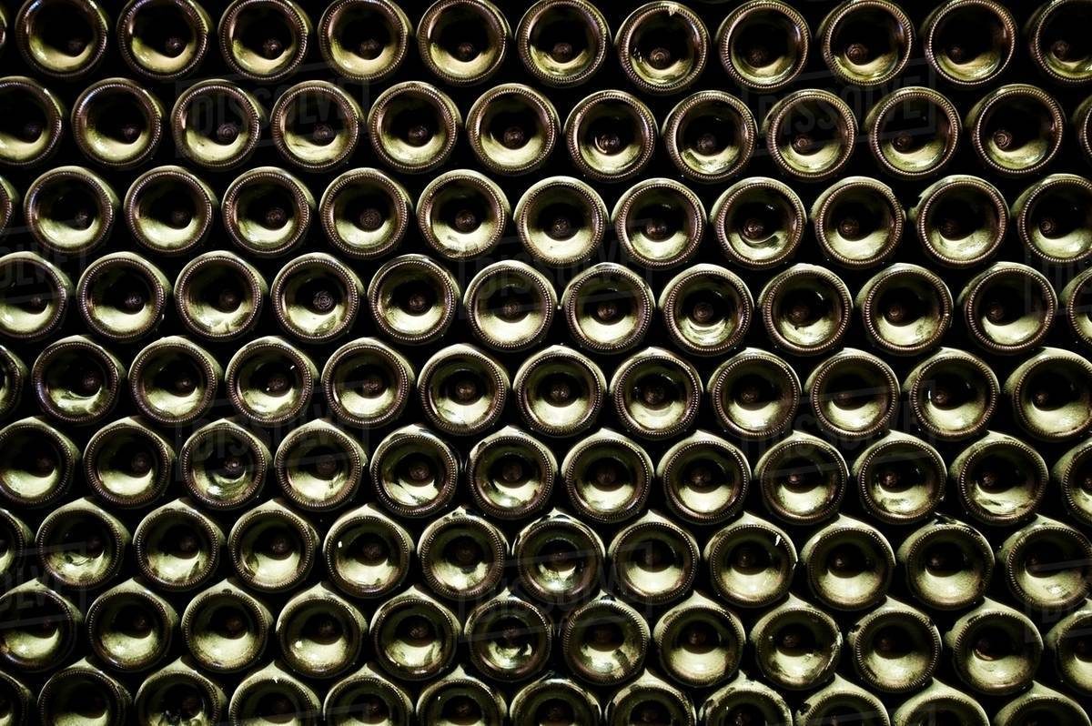 Stack of wine bottles, full frame - Royalty-free Stock Photo | Dissolve