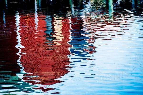 Buildings reflected in water - Royalty-free Stock Photo | Dissolve