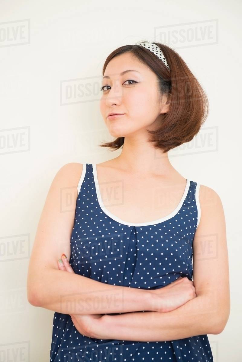 Woman wearing polka dots in haughty pose - Stock Photo - Dissolve