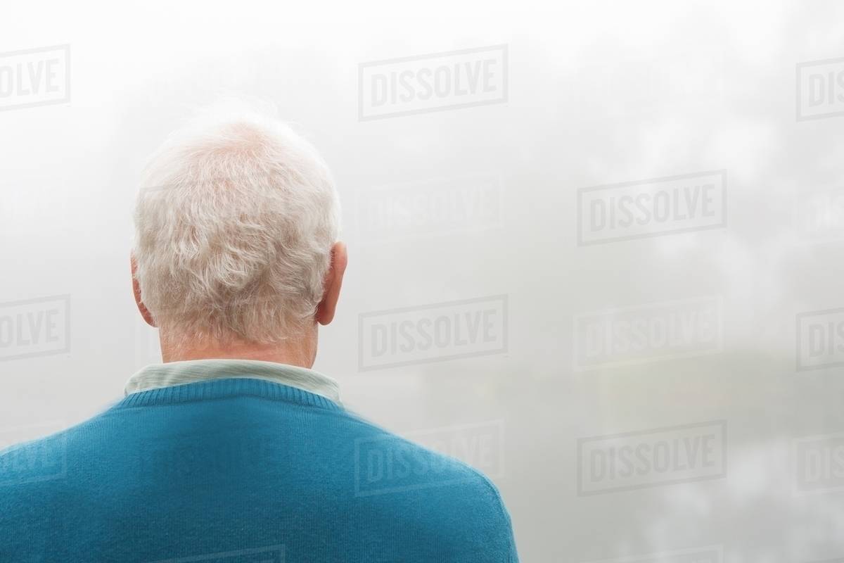 Back view of senior man in blue top - Royalty-free Stock Photo | Dissolve