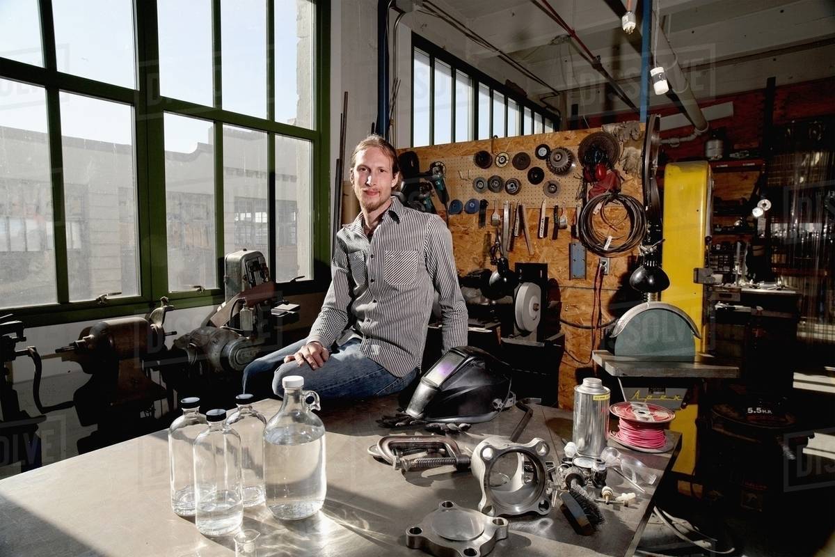 Portrait of young male vodka distiller in distillery workshop - Royalty ...