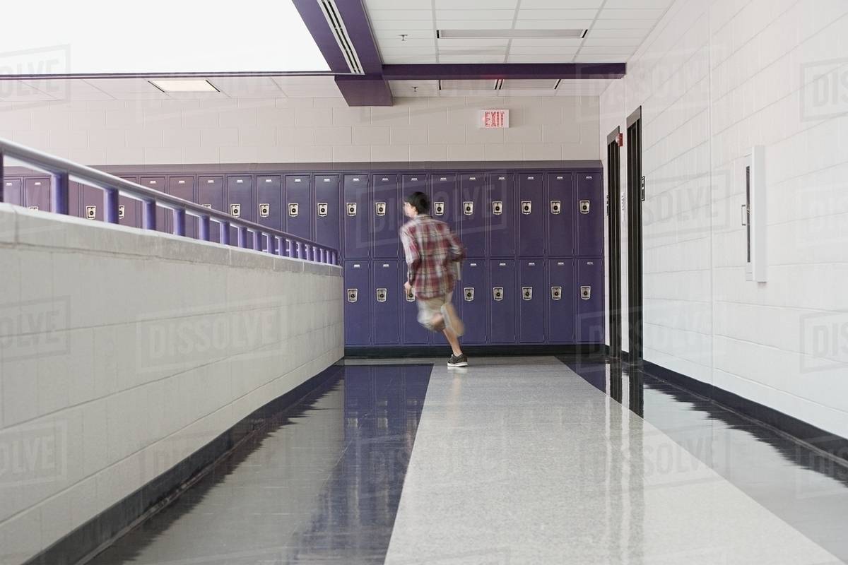 A male high school student running in a corridor - Royalty-free Stock ...