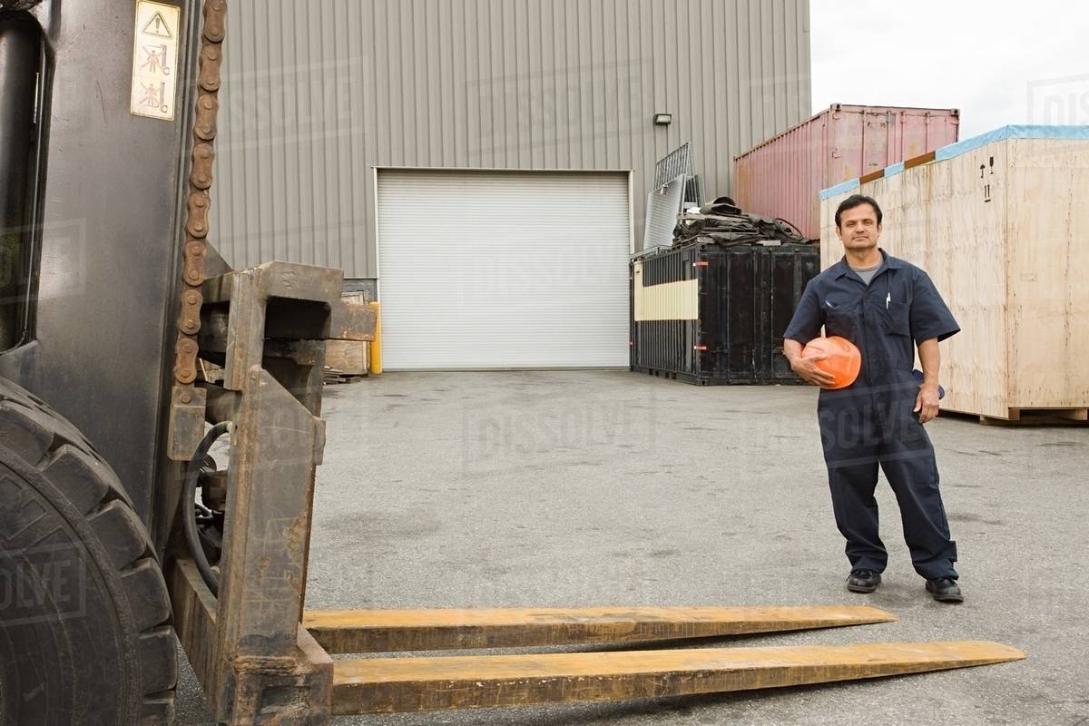 Worker in loading bay - Stock Photo - Dissolve