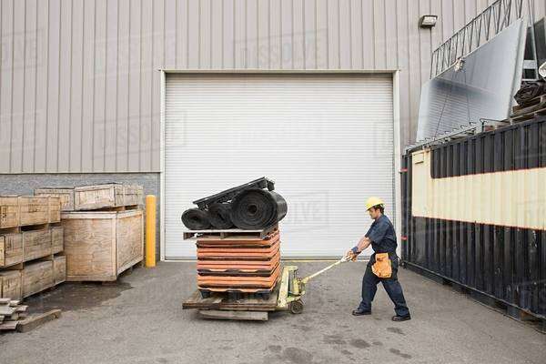 Worker in loading bay - Royalty-free Stock Photo | Dissolve