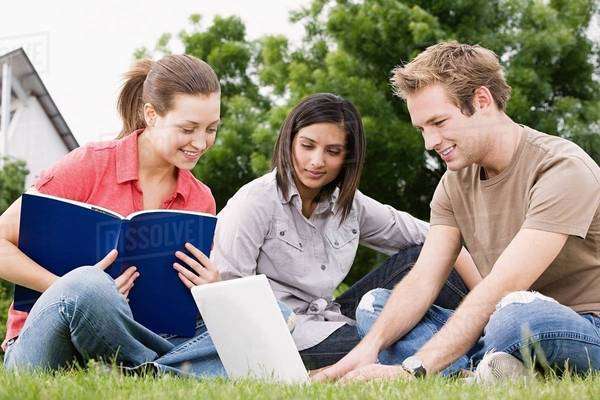 Students working outdoors - Stock Photo - Dissolve