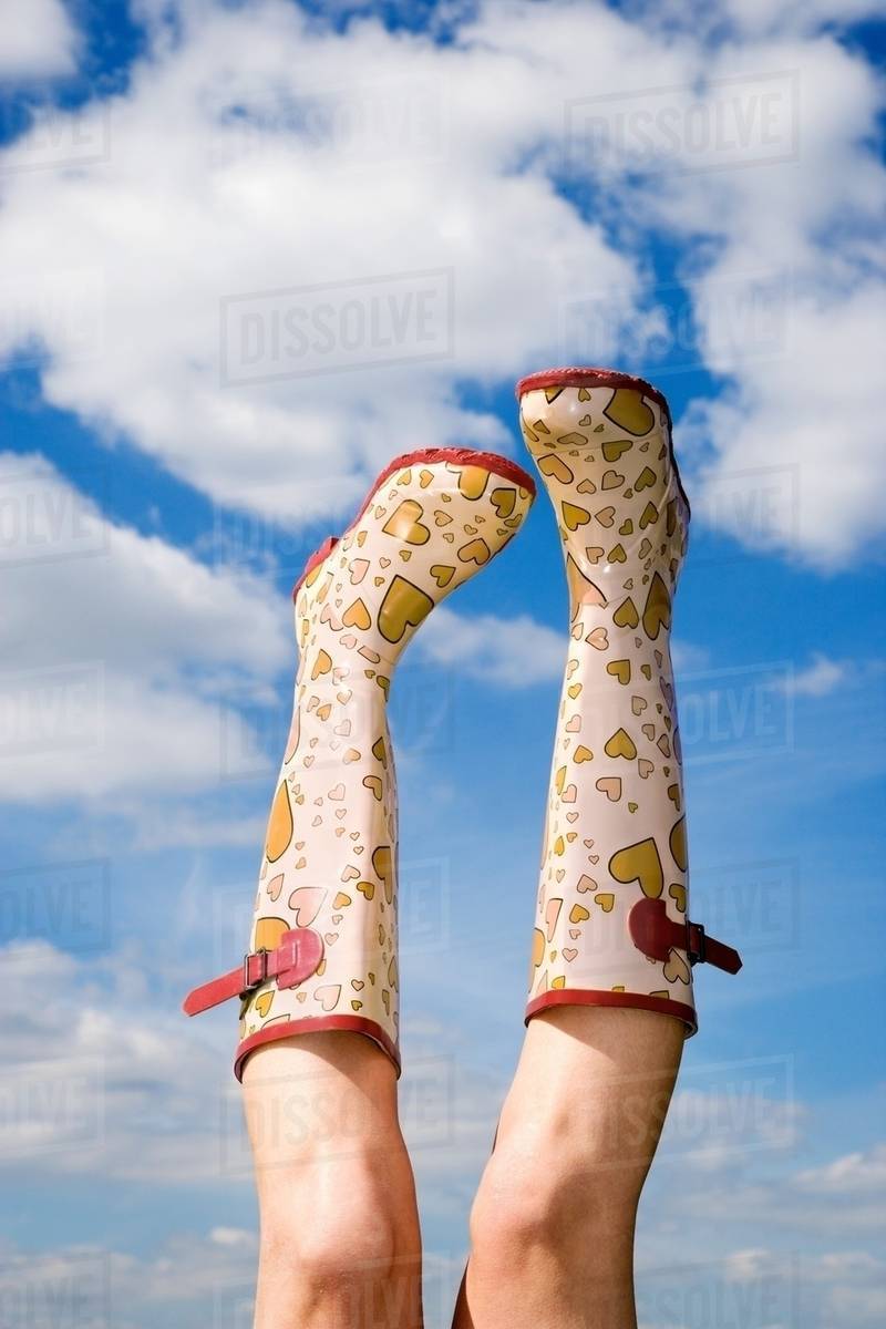 Person wearing rubber boots - Royalty-free Stock Photo | Dissolve