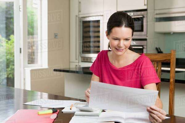 Woman with paperwork - Royalty-free Stock Photo | Dissolve