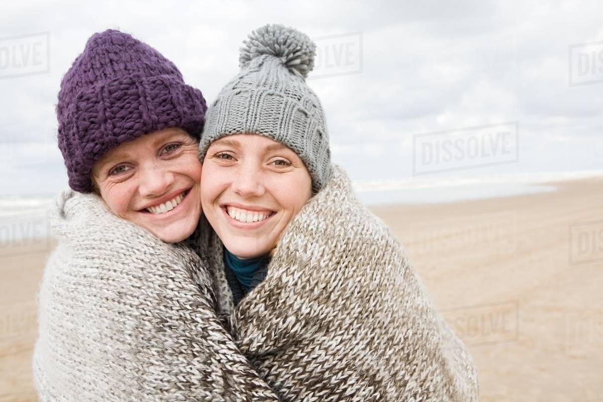 Women sharing a blanket - Royalty-free Stock Photo | Dissolve