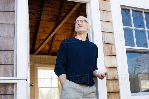 Man outside house - Royalty-free Stock Photo | Dissolve