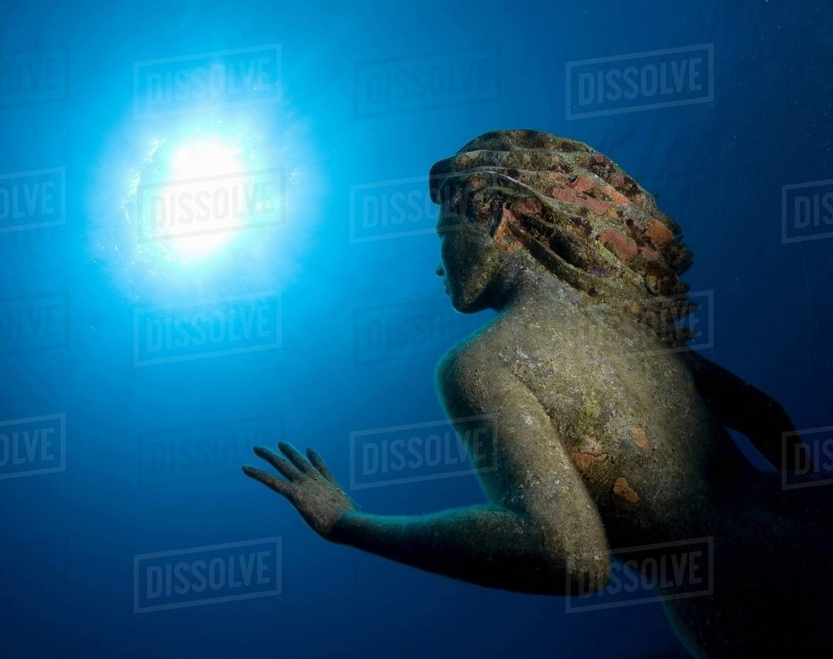 Sunken statue underwater - Royalty-free Stock Photo | Dissolve