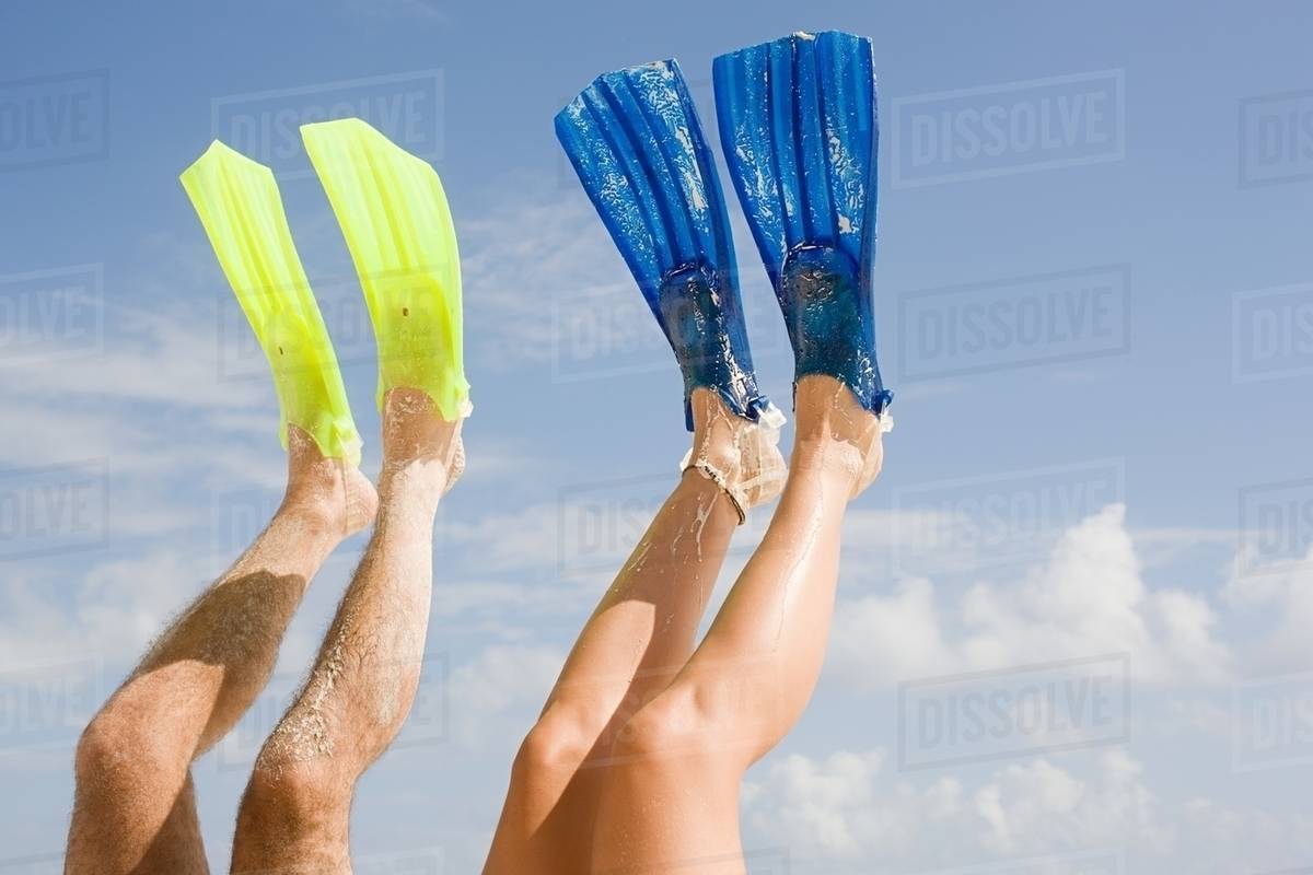 People wearing flippers - Stock Photo - Dissolve