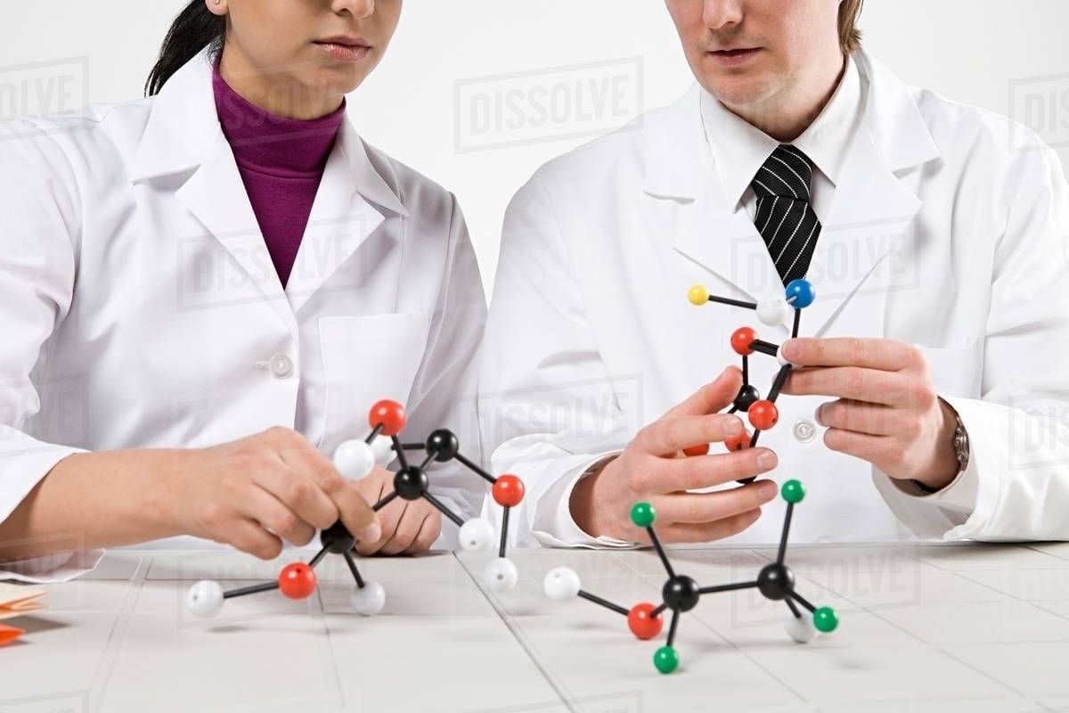 Scientists with molecule models - Royalty-free Stock Photo | Dissolve