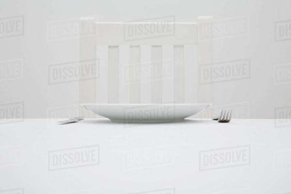 Chair plate and cutlery - Royalty-free Stock Photo | Dissolve