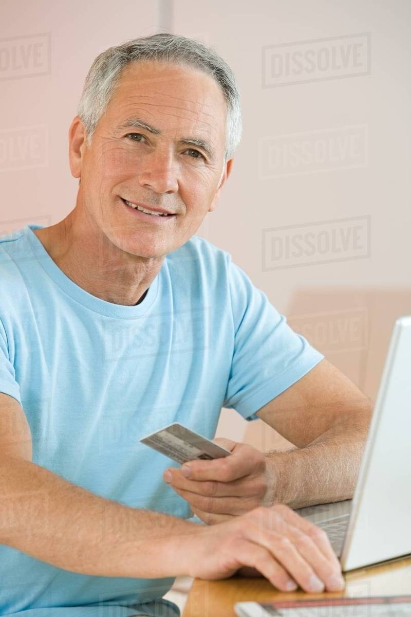 A man buying online - Stock Photo - Dissolve