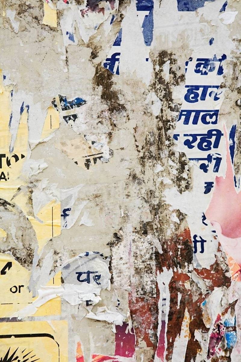 Torn posters on a wall - Stock Photo - Dissolve