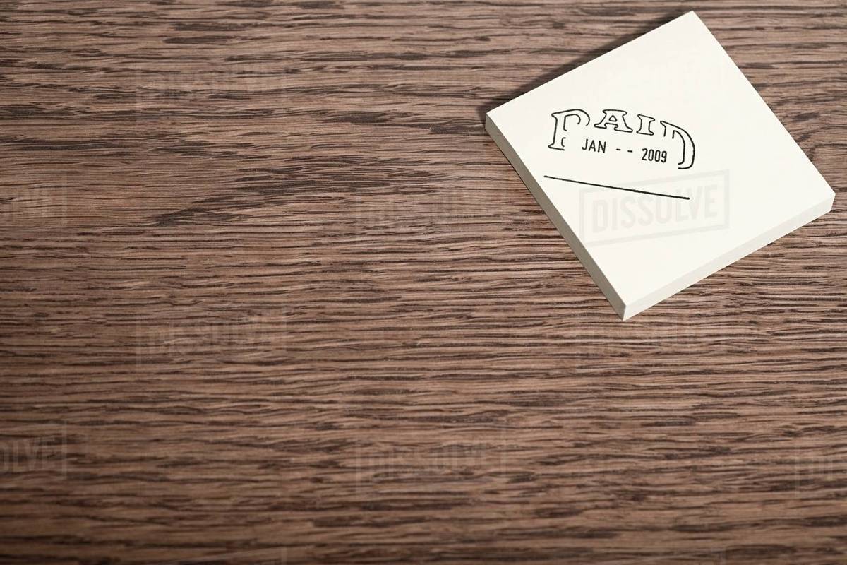 Stamp on adhesive note - Stock Photo - Dissolve