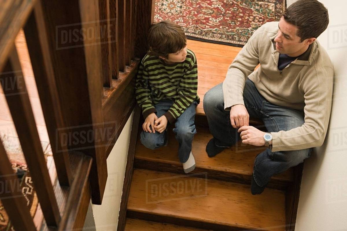 A father giving his son advice - Stock Photo - Dissolve