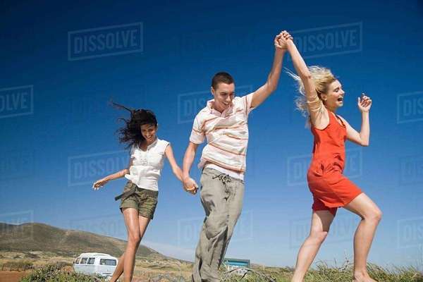 Friends skipping - Stock Photo - Dissolve