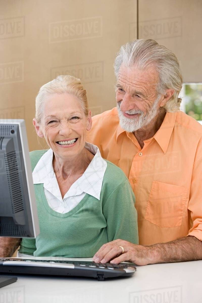 Senior couple using computer - Royalty-free Stock Photo | Dissolve