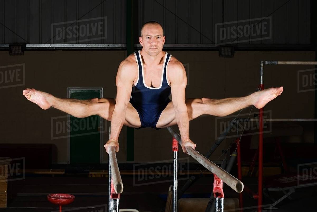 Gymnast on parallel bars - Stock Photo - Dissolve