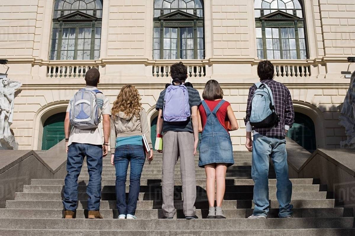 High school students standing on stairs - Stock Photo - Dissolve
