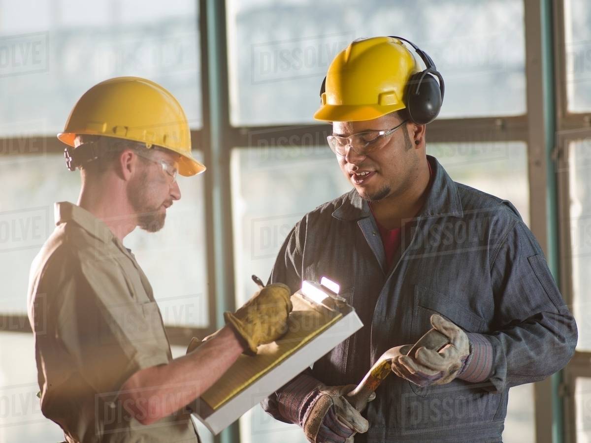 Engineers talking on construction site - Royalty-free Stock Photo ...
