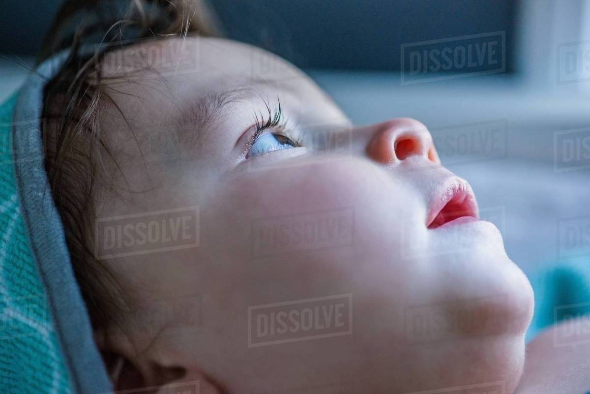 Close up of baby boy gazing - Royalty-free Stock Photo | Dissolve
