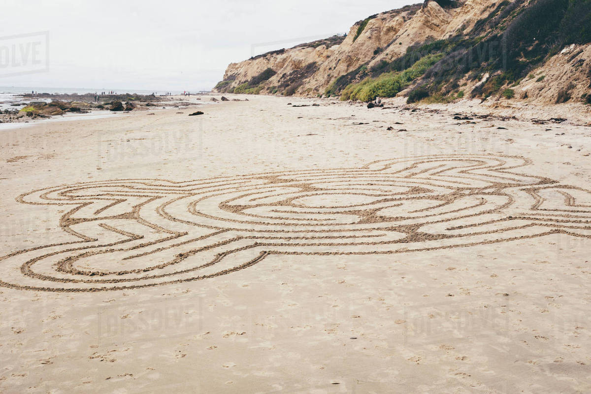 Line drawing pattern drawn onto beach sand, Crystal Cove State Park ...