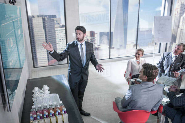 Businessman pointing at screen at presentation, New York, USA - Stock ...