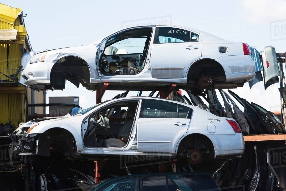 Cars stacked in scrap yard - Royalty-free Stock Photo | Dissolve